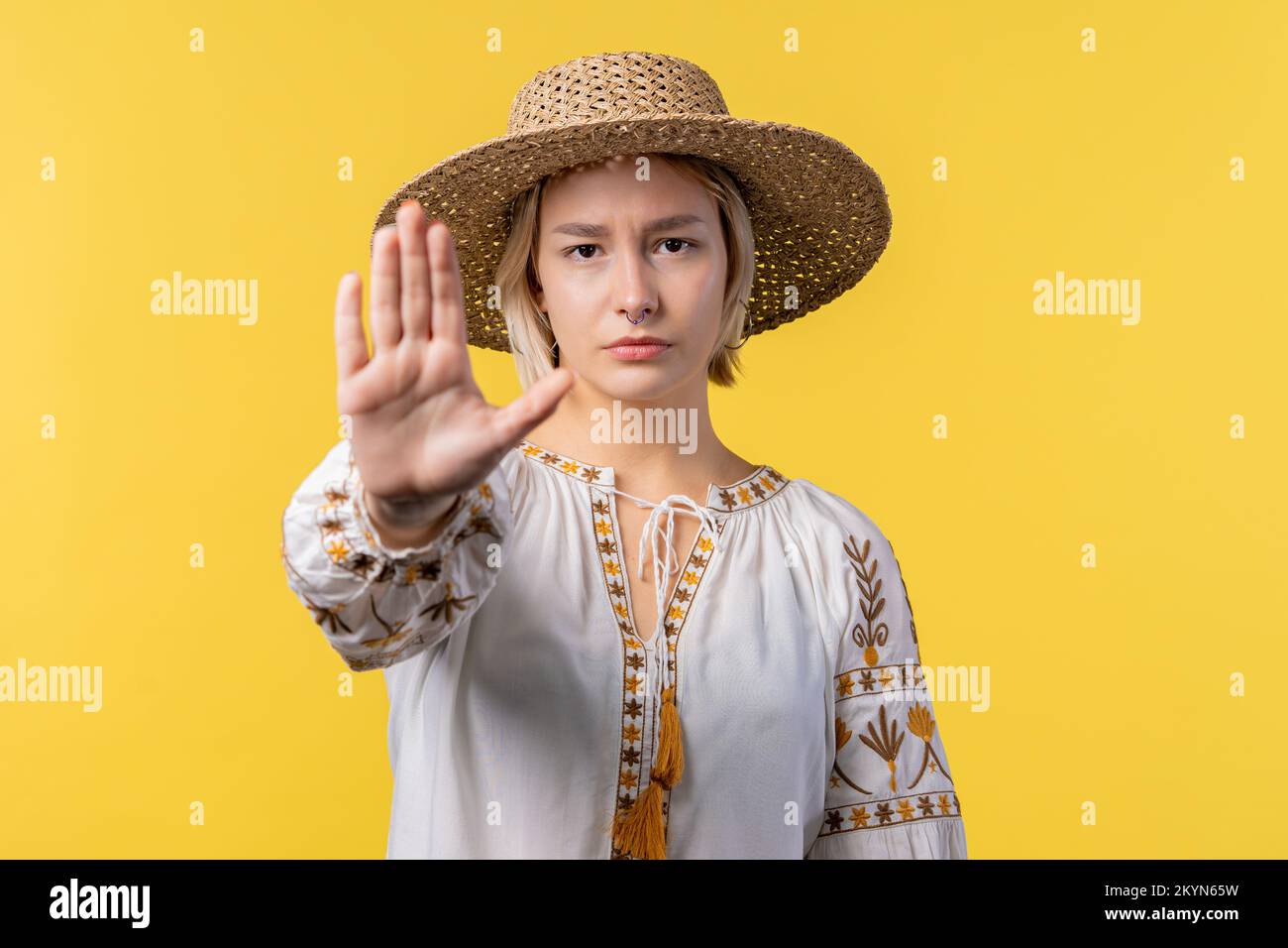 Uninterested ukrainian woman disapproving with NO hand sign gesture ...