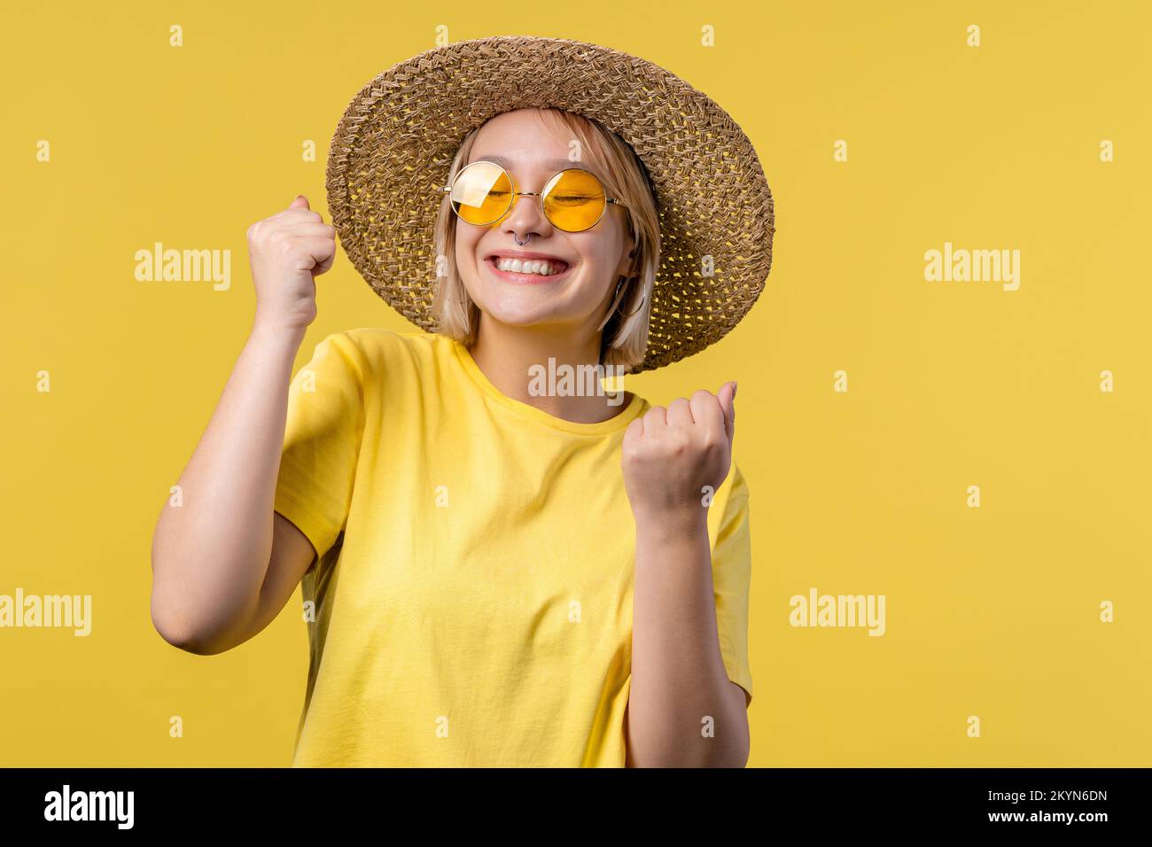 Pretty woman shows triumph yes gesture of victory, she achieved result ...