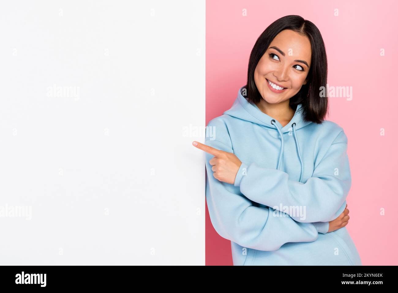 Photo of shiny dreamy girl dressed blue sweatshirt looking pointing ...
