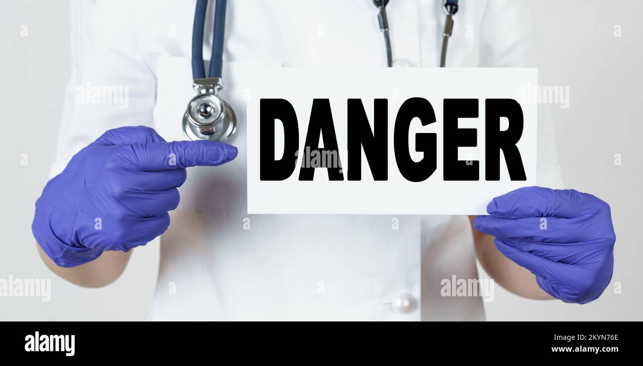Medicine and health concept. The doctor points his finger at a sign ...