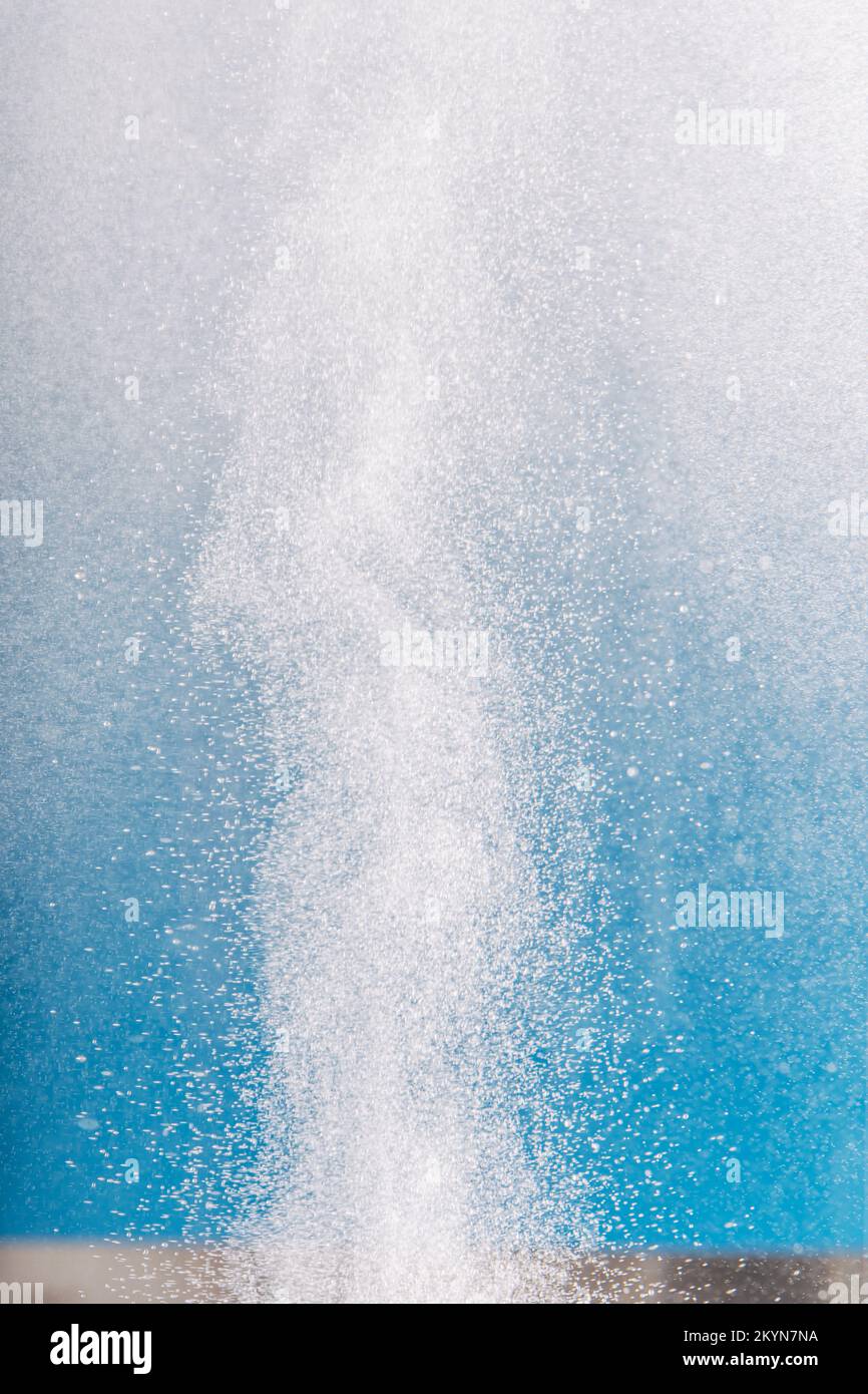 Column of hydrogen bubbles in water against blue background Stock Photo ...