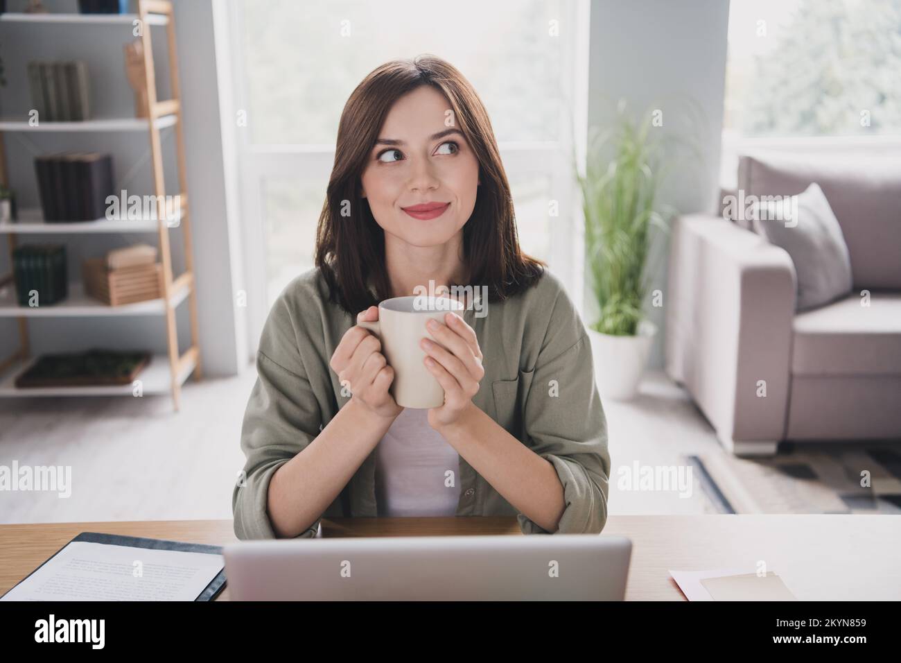 Portrait of peaceful positive lawyer lady hands hold hot tea cacao mug ...