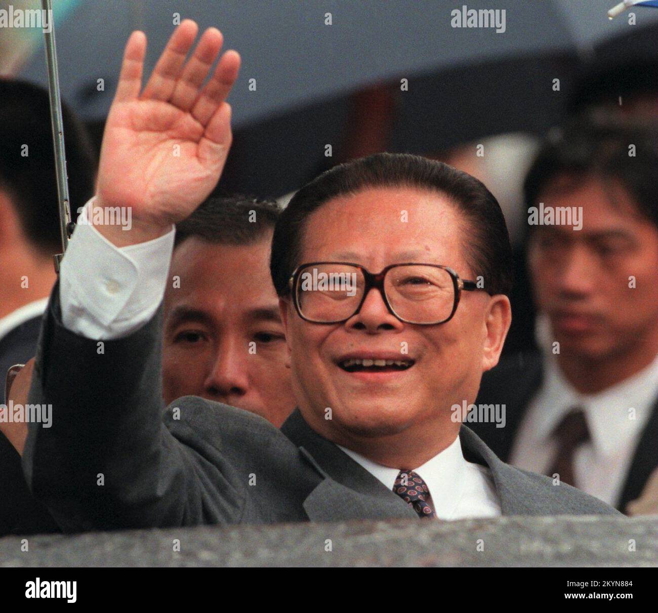 President Jiang Zemin waves after arriving on Hong Kong on the last day ...