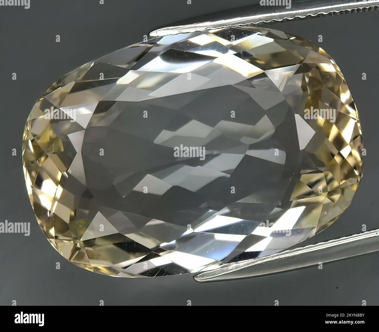 Natural gemstone yellow topaz on a background Stock Photo - Alamy