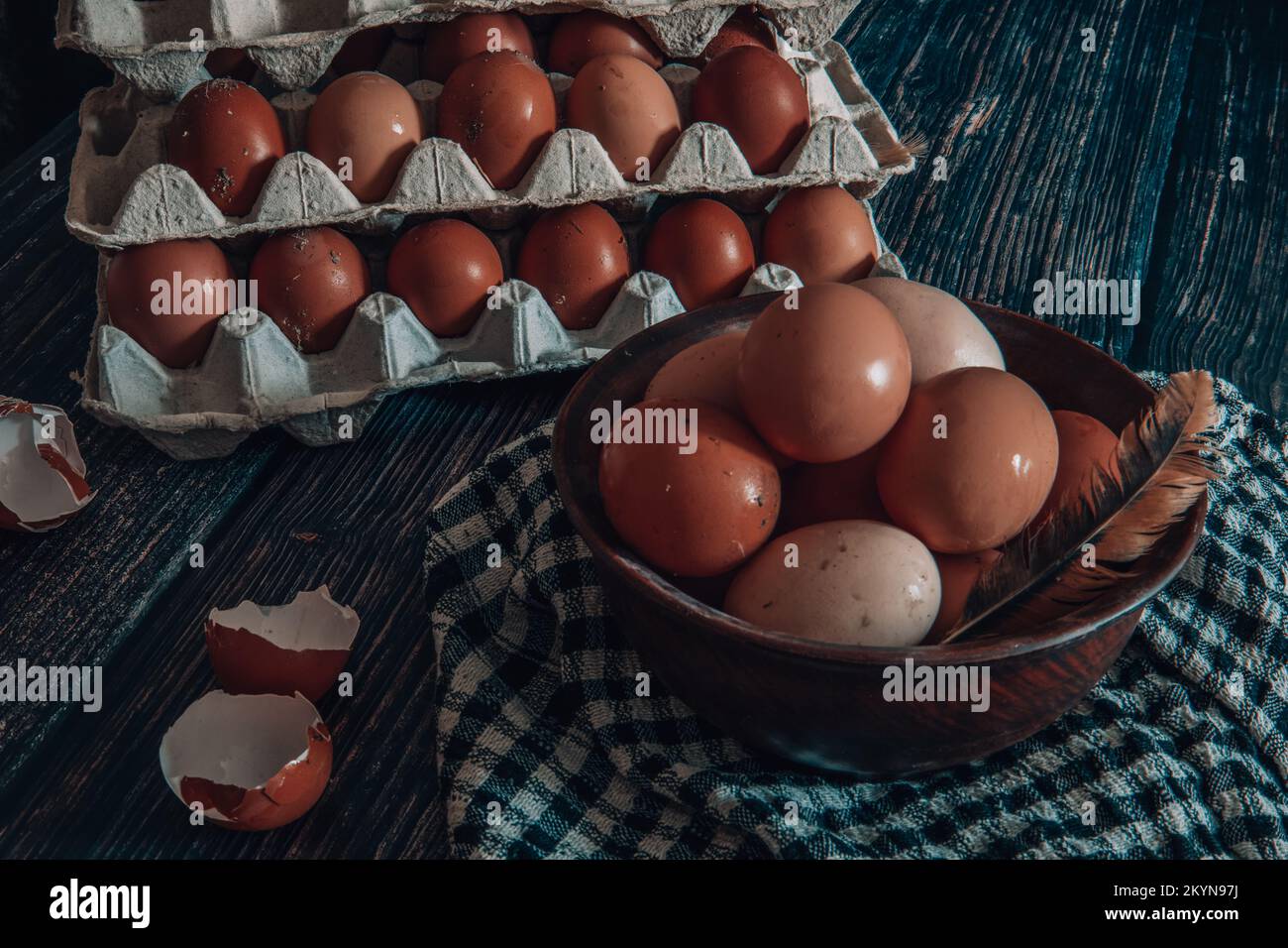 Chicken eggs in a clay plate and trays on the table Stock Photo - Alamy