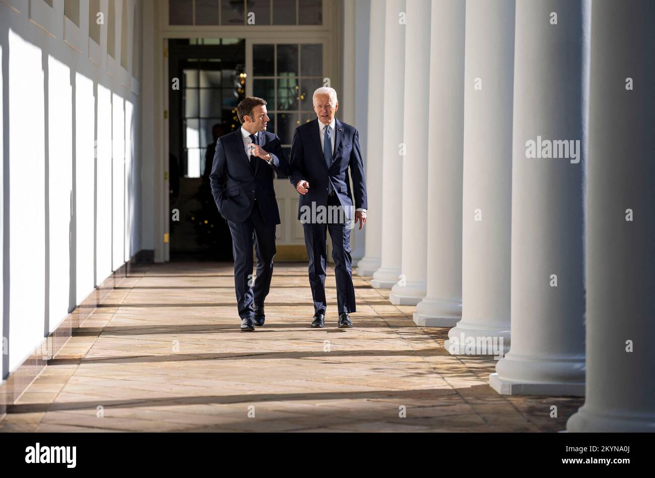President Joe Biden with President Emmanuel Macron walk down the ...