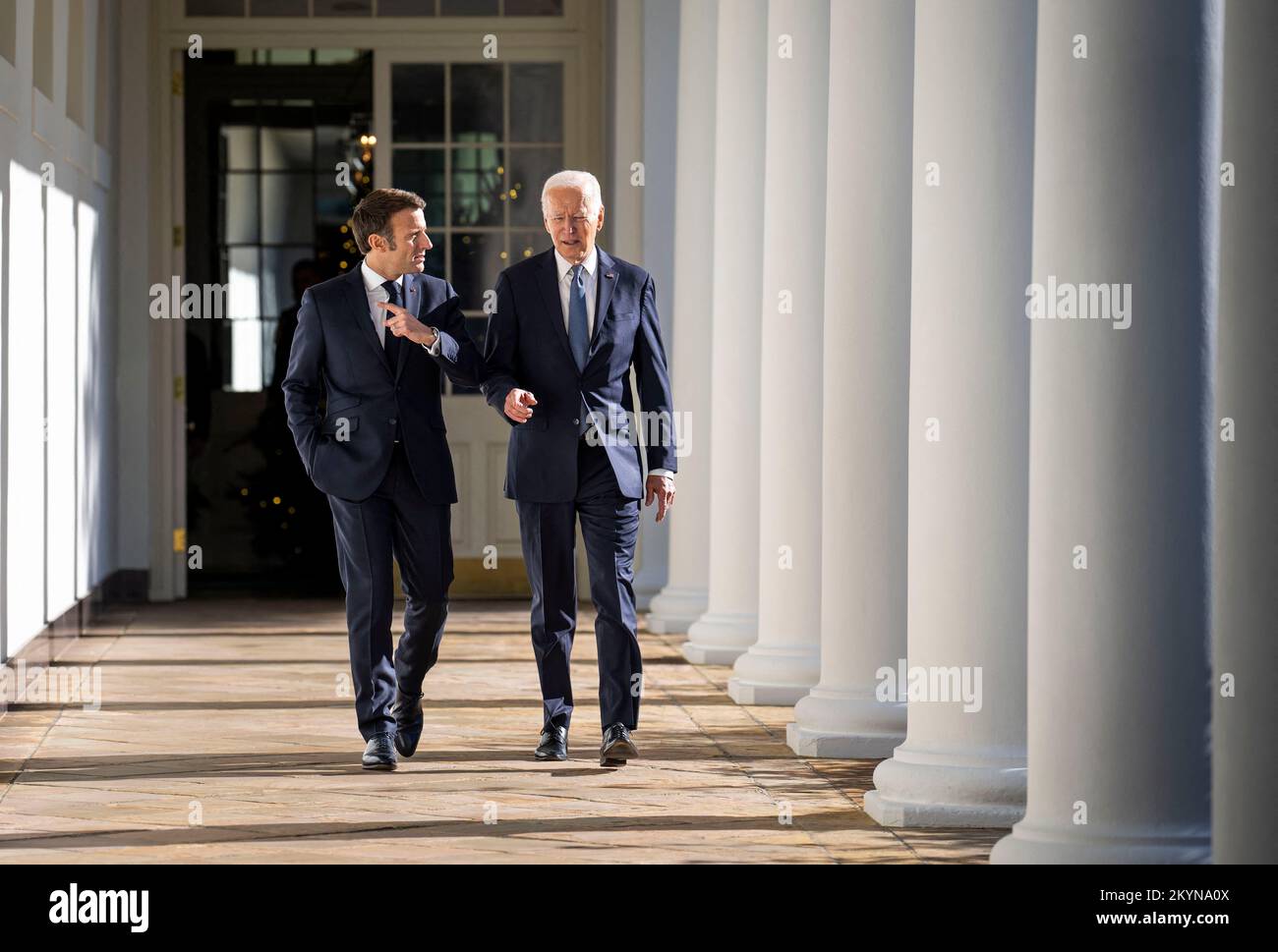 President Joe Biden with President Emmanuel Macron walk down the ...