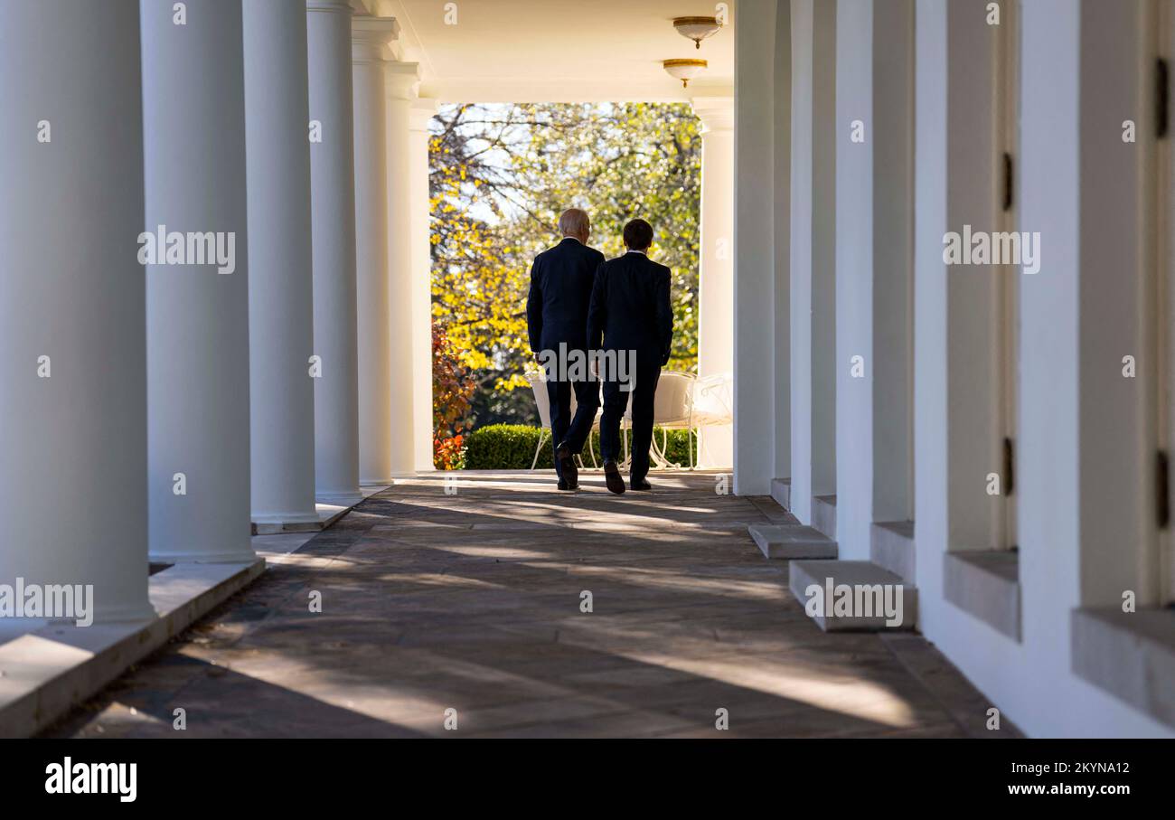 President Joe Biden with President Emmanuel Macron walk down the ...