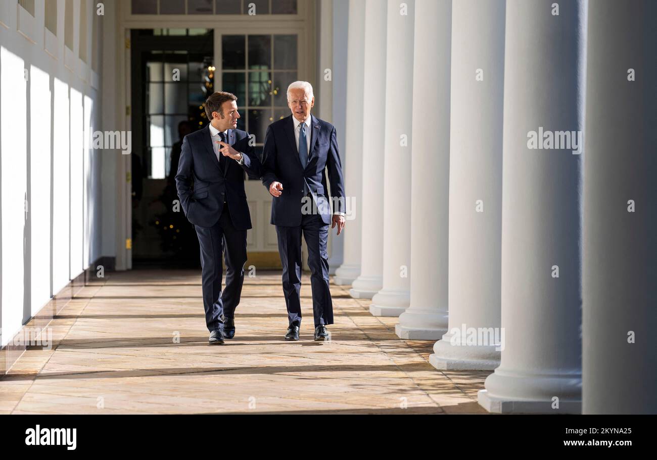 President Joe Biden with President Emmanuel Macron walk down the ...