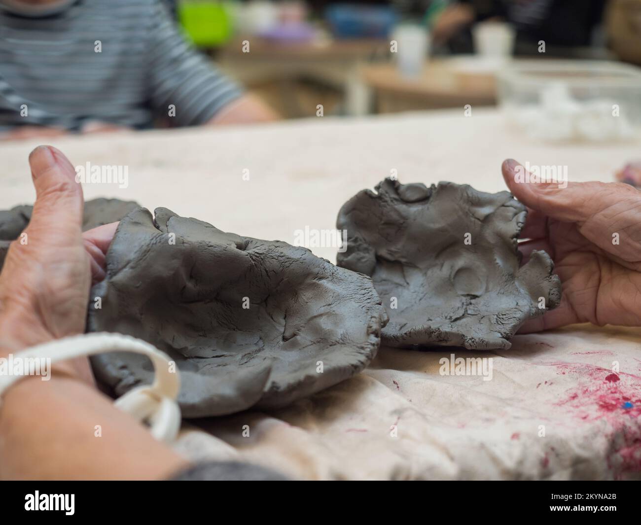 Senior activity concept. Workshop for clay sticking for seniors ...