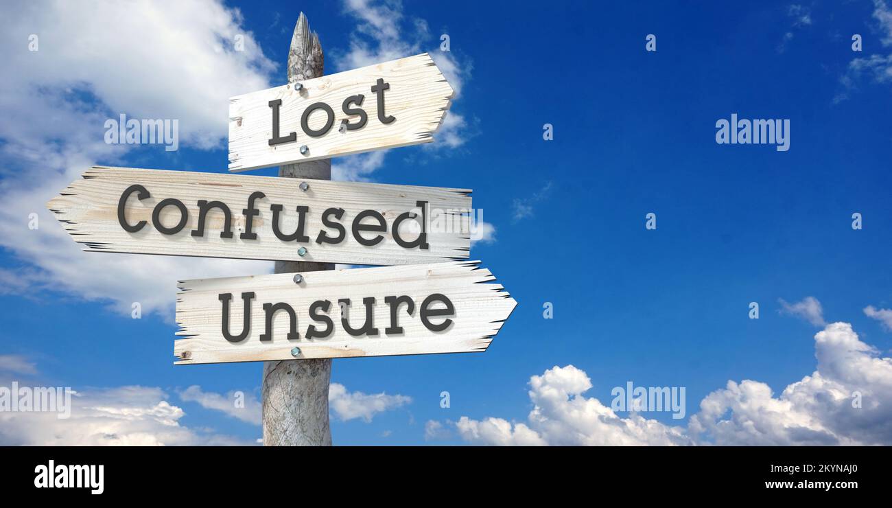 Lost, confused, unsure - wooden signpost with three arrows Stock Photo ...