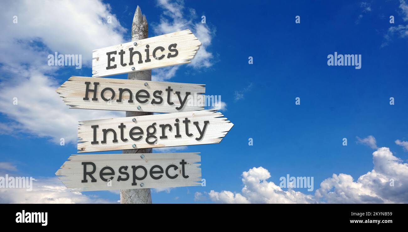 Ethics, honesty, integrity, respect - wooden signpost with four arrows ...
