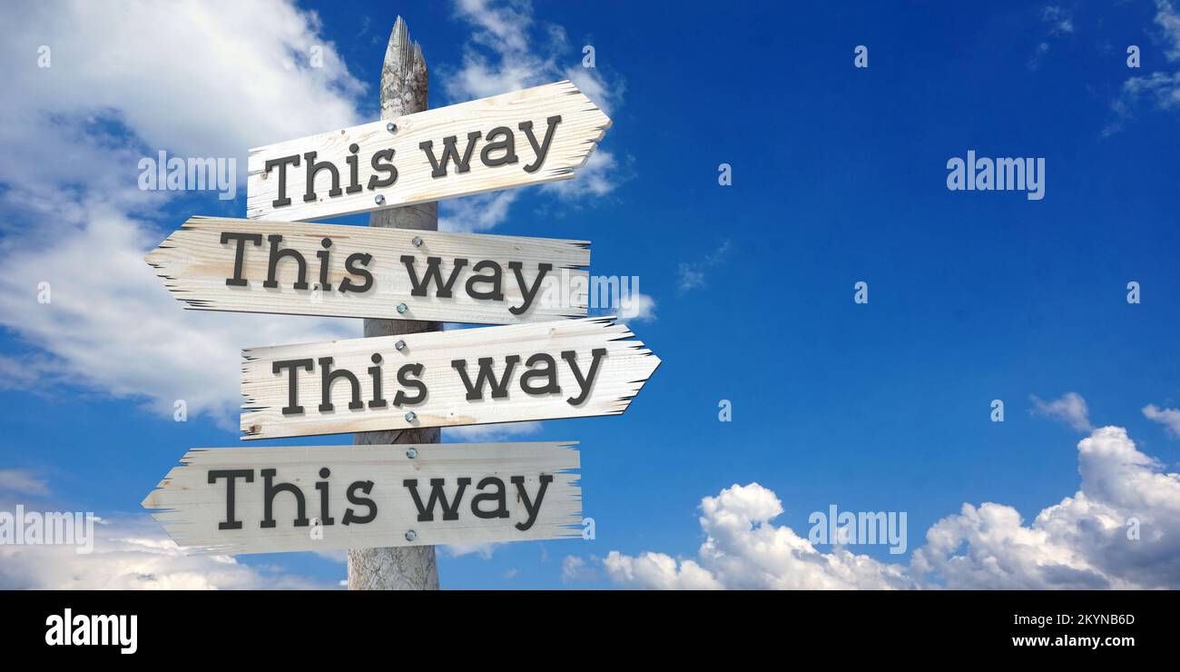 This way - wooden signpost with four arrows Stock Photo - Alamy This way - wooden signpost with four arrows Stock Photo - Alamy