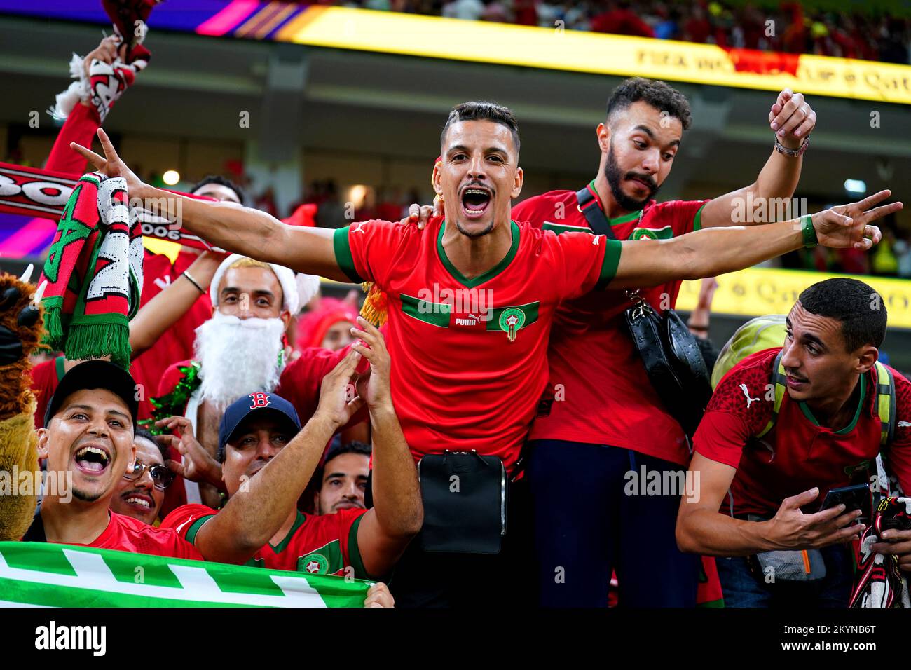 Morocco fans celebrate at the end of the FIFA World Cup Group F match at the Al Thumama Stadium ...