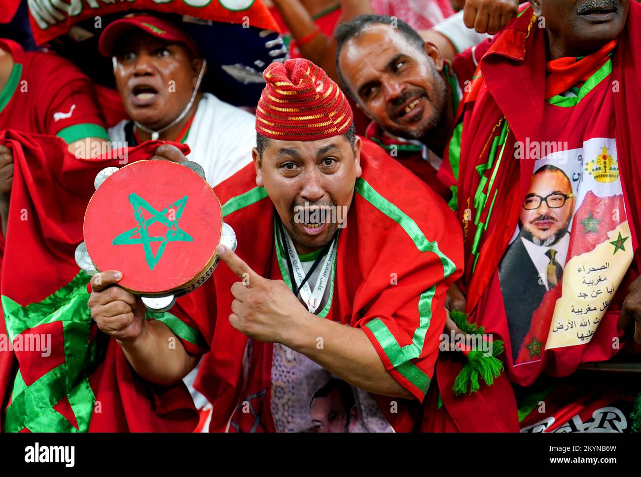 Morocco fans celebrate at the end of the FIFA World Cup Group F match at the Al Thumama Stadium ...