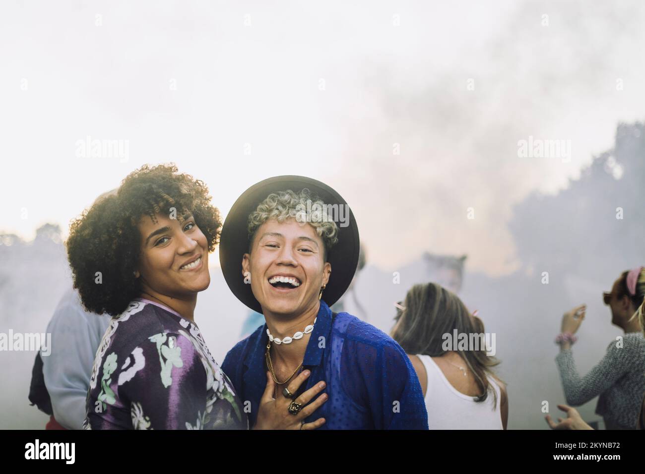Portrait of happy young transgender friends enjoying at gay pride ...