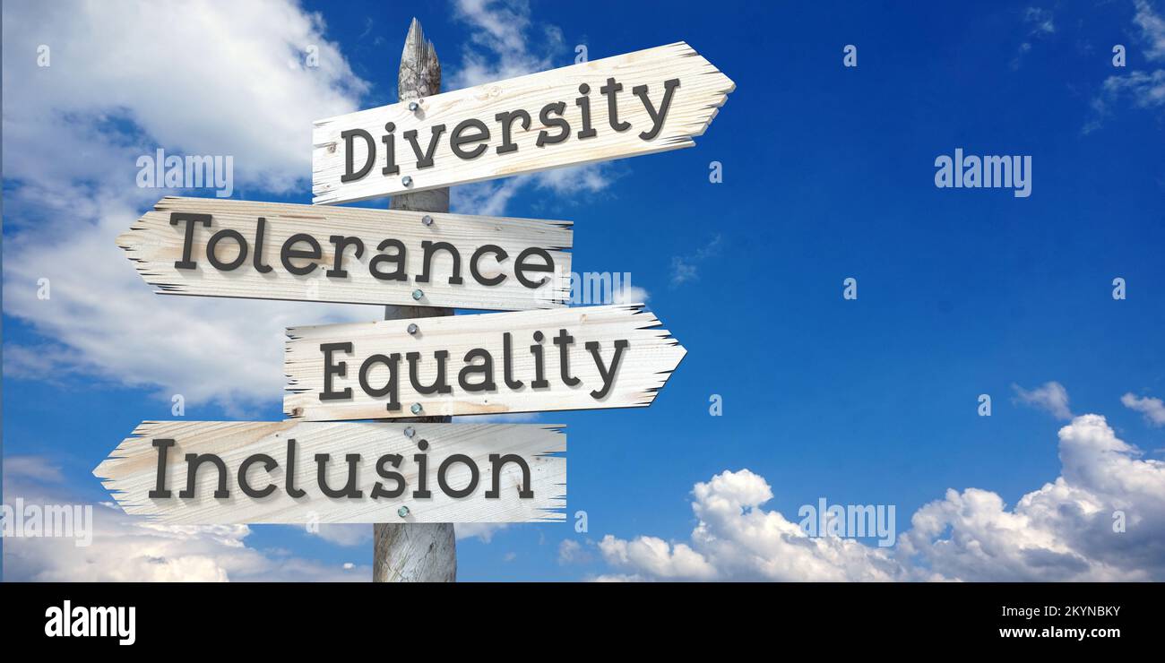 Diversity, tolerance, equality, inclusion - wooden signpost with four ...