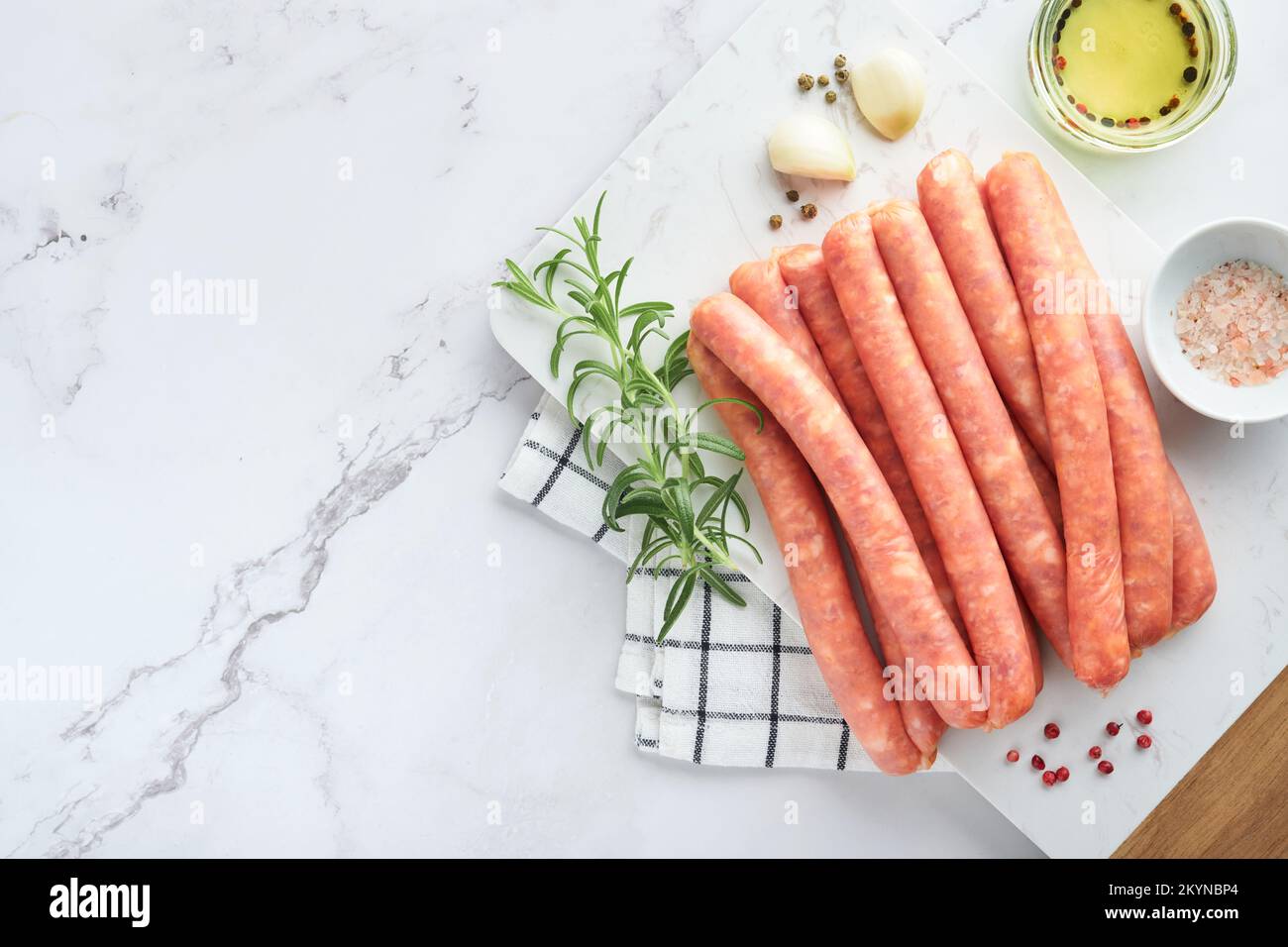 Meat beef sausages. Raw barbecue sausages with spices, vegetables and ...