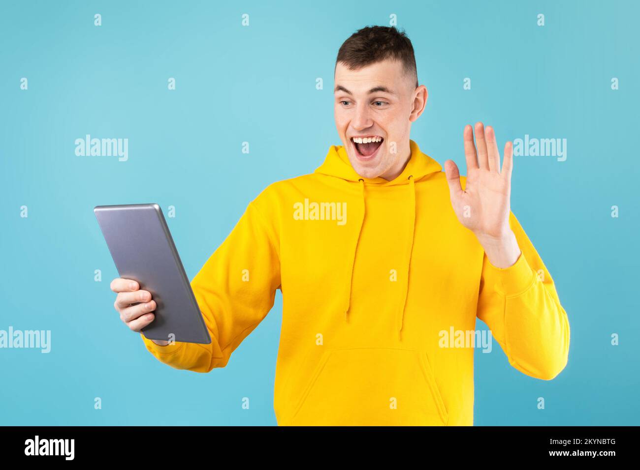 Video call. Excited caucasian man chatting online via digital tablet ...