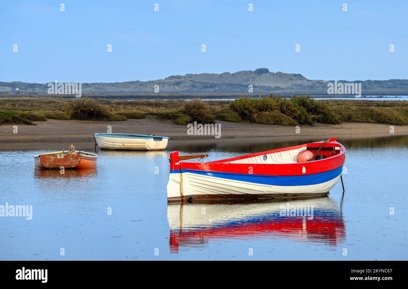 Boats caught by late afternoon light in the harbour at Burnham Overy ...