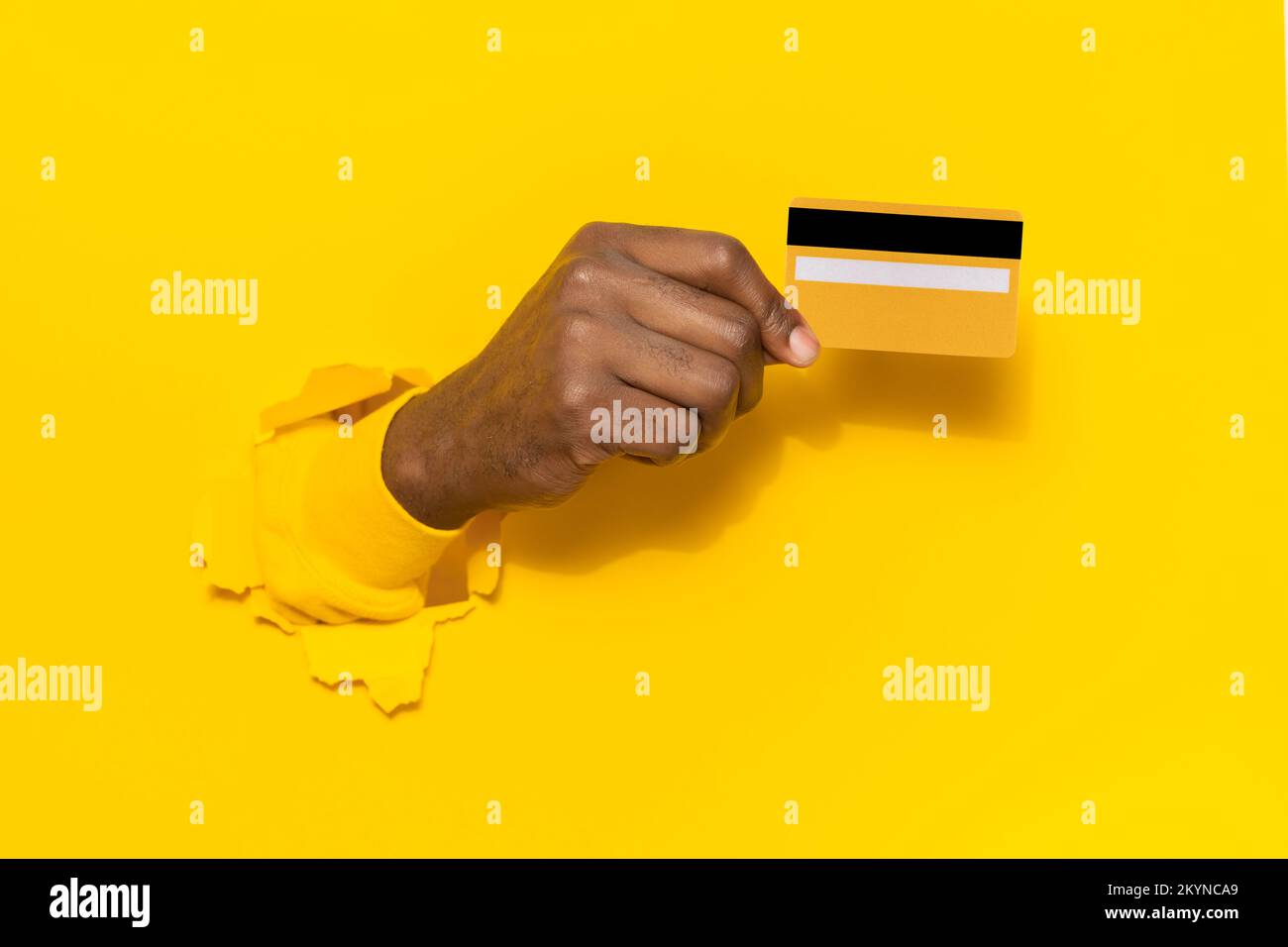 Easy payment. African american male hand holding plastic credit card ...