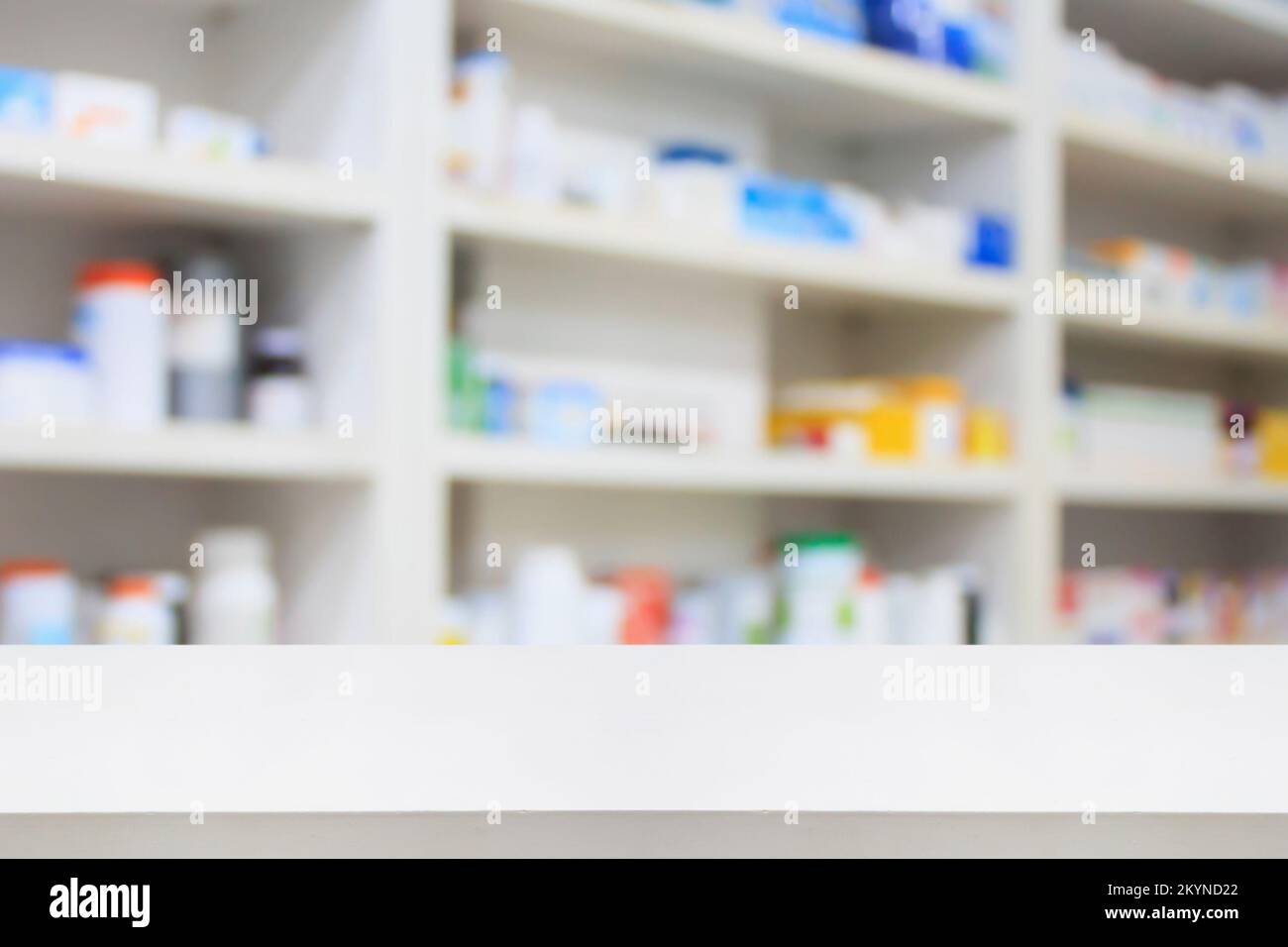 Pharmacy counter store table background with medicine shelves in ...
