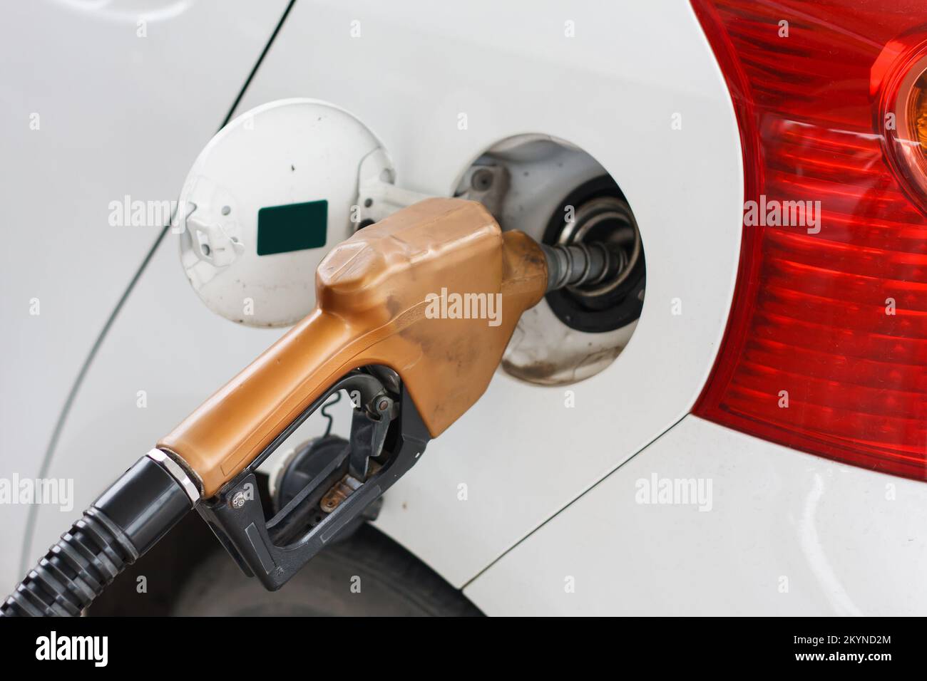 To fill the machine with fuel. Car fill with gasoline at a gas station ...