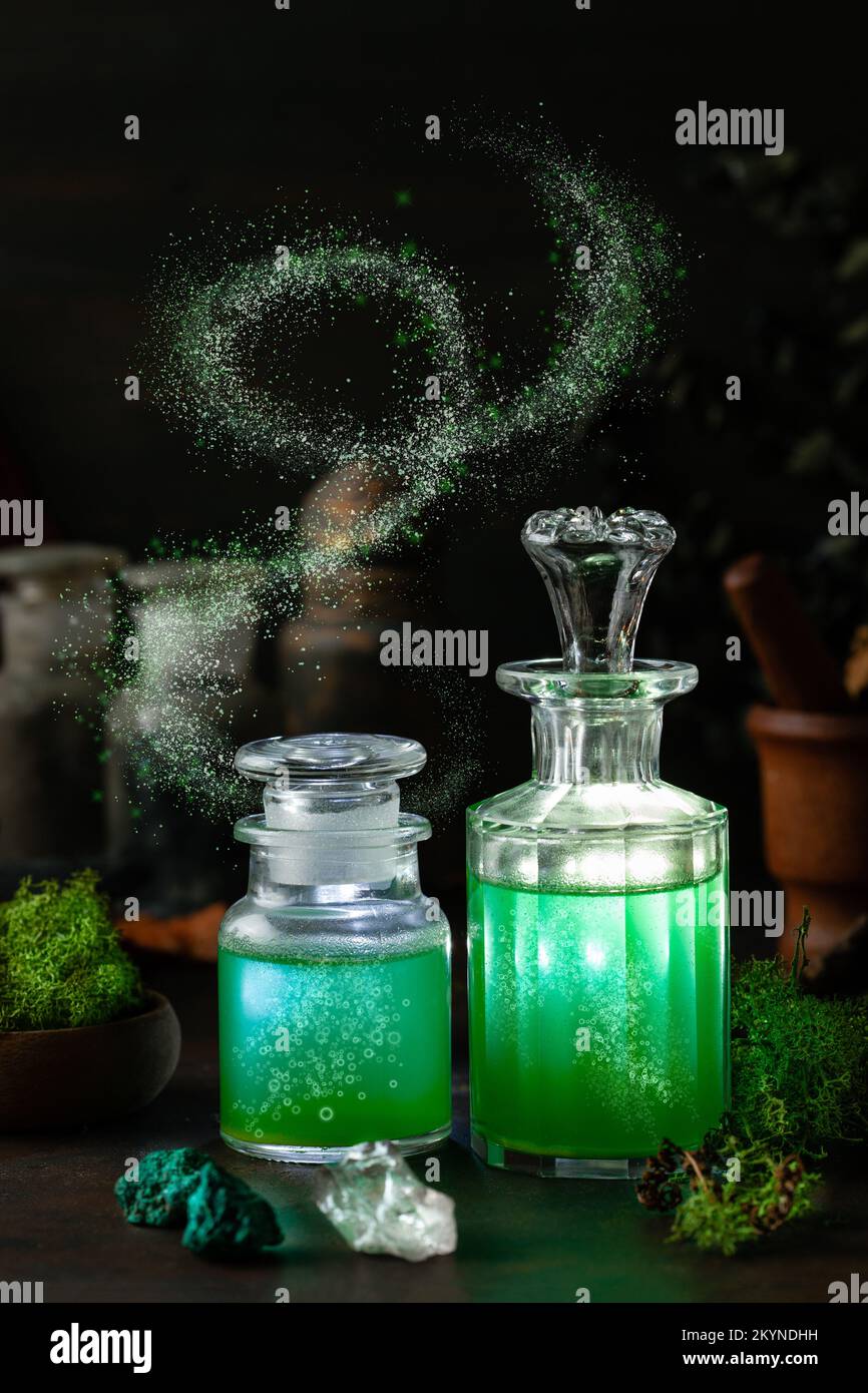 Witchcraft still life concept with smoking potion, herbs ingredients ...