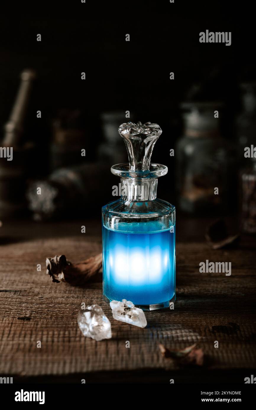 Witchcraft still life concept with potion, herbs ingredients and ...