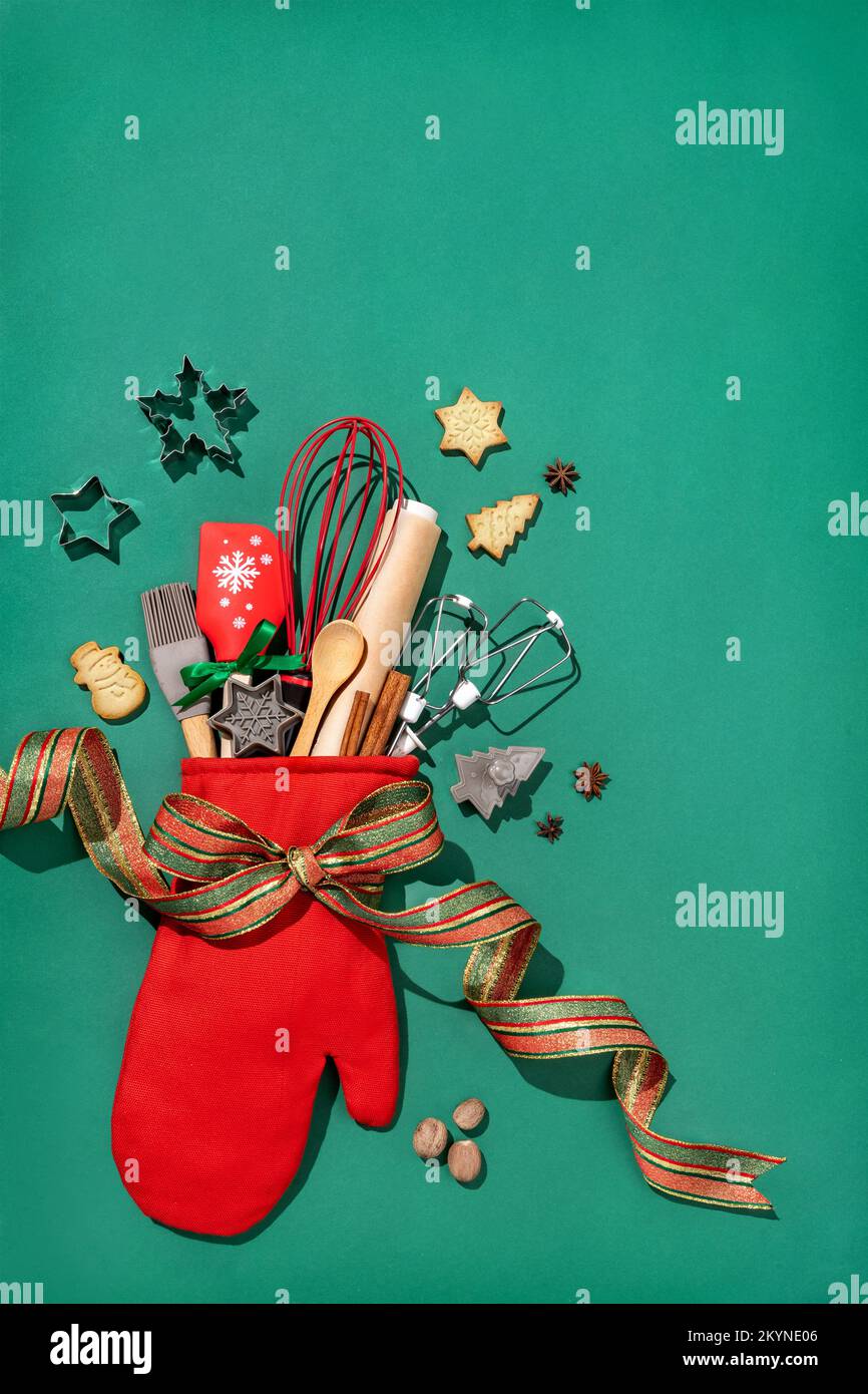 Christmas red oven-glove with kitchen utensils for homemade baking on ...