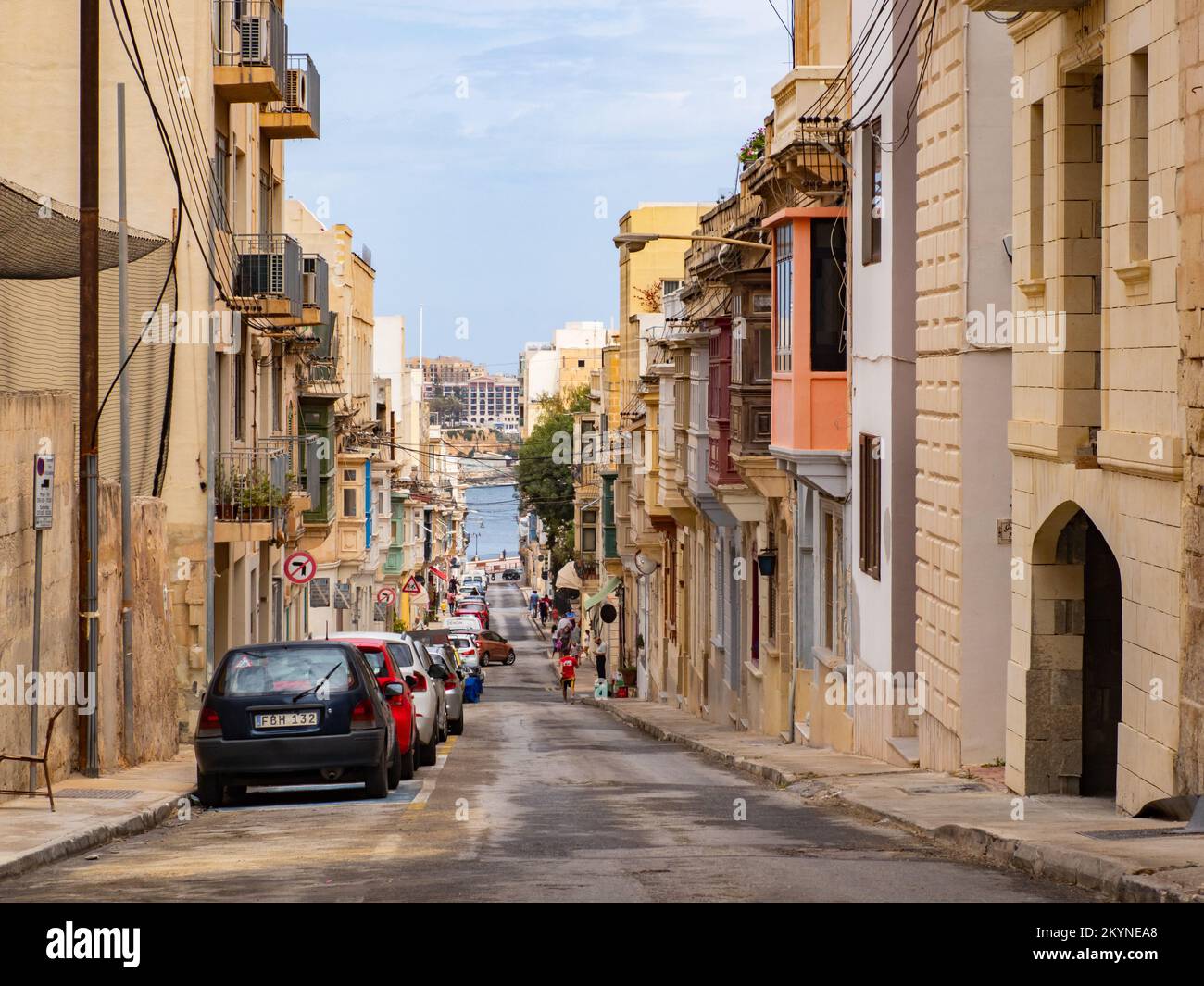 Sliema, Malta - May, 2021: Narrow street and historic sand-colored ...