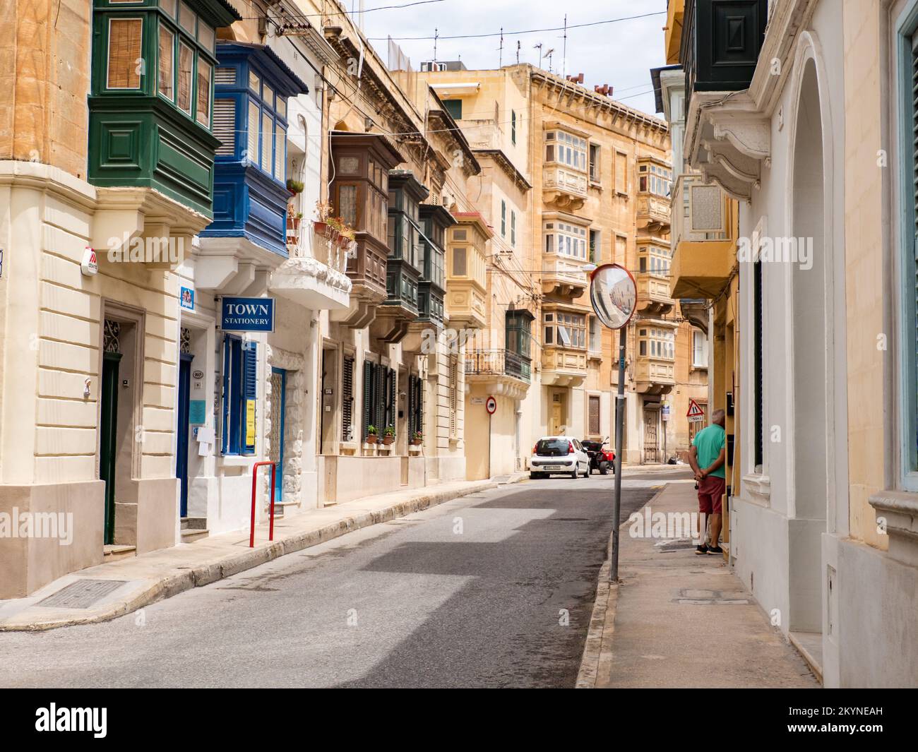 Sliema, Malta - May, 2021: Narrow street and historic sand-colored ...