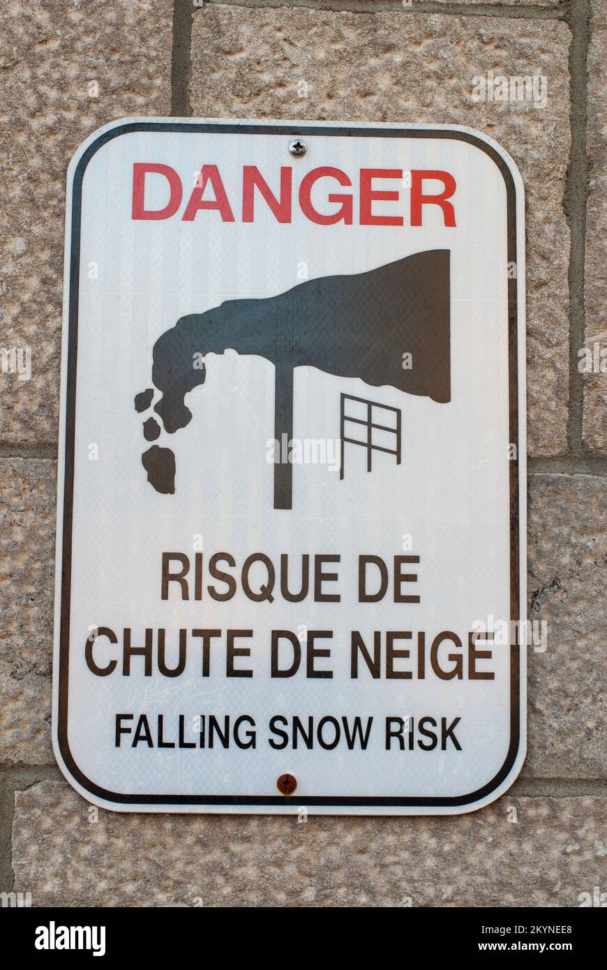 Danger falling snow from roof sign in Quebec City Stock Photo - Alamy