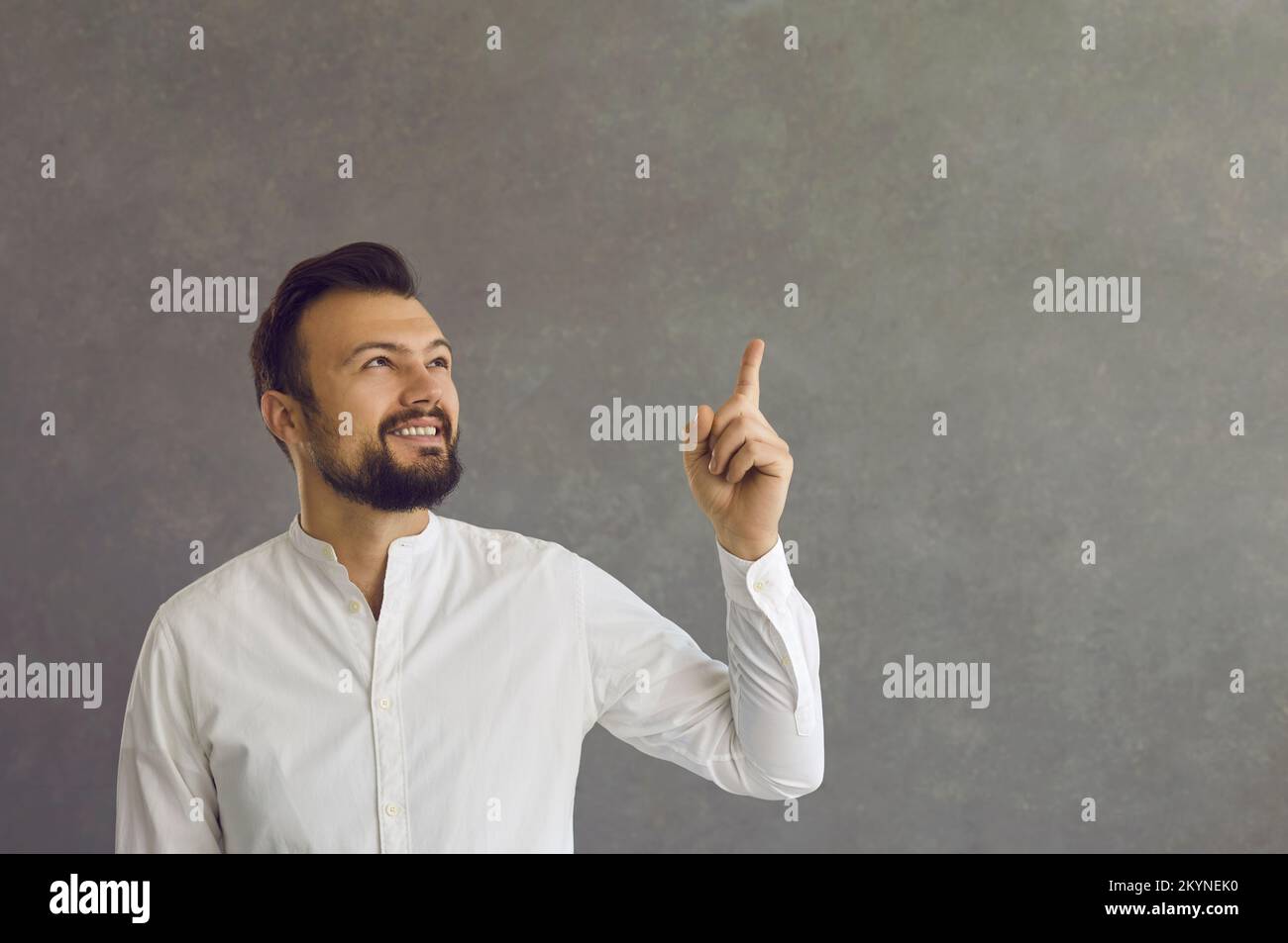 The young man shows his forefinger up Stock Photo - Alamy