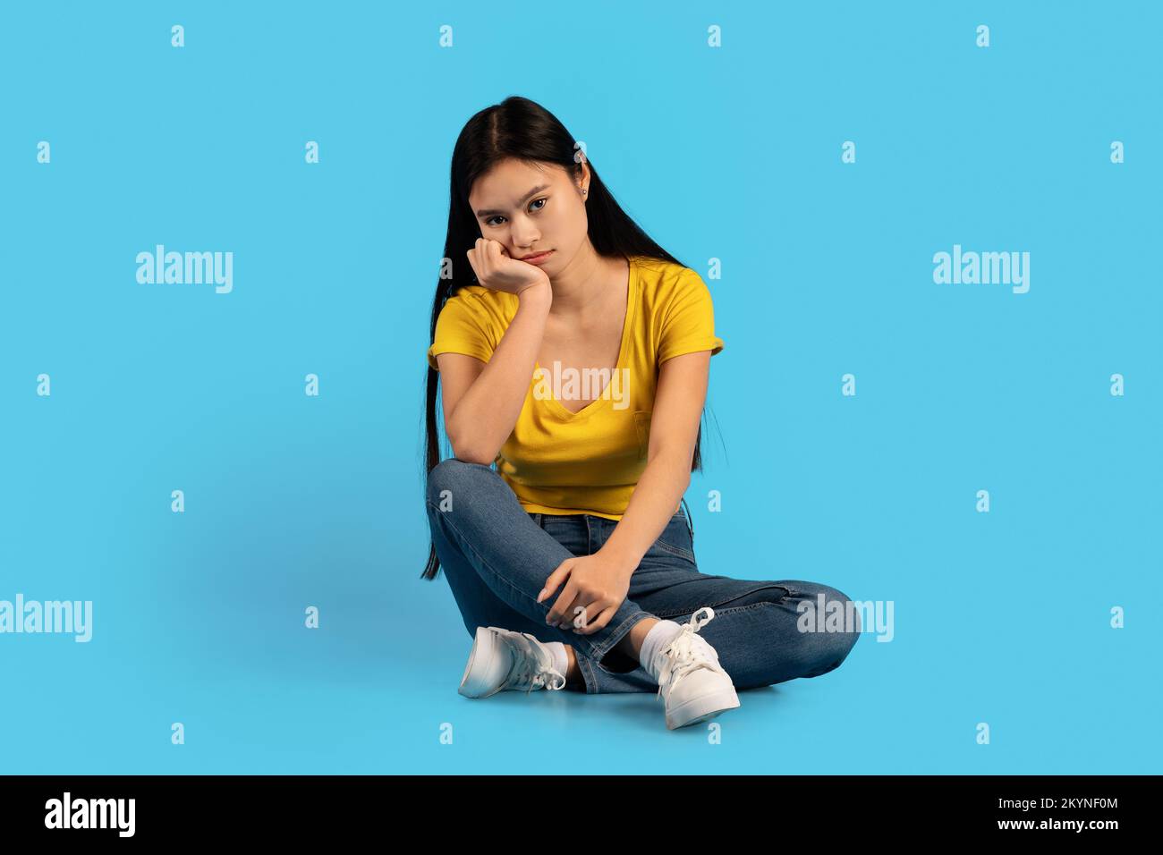 Sad upset tired millennial korean woman student sitting on floor ...