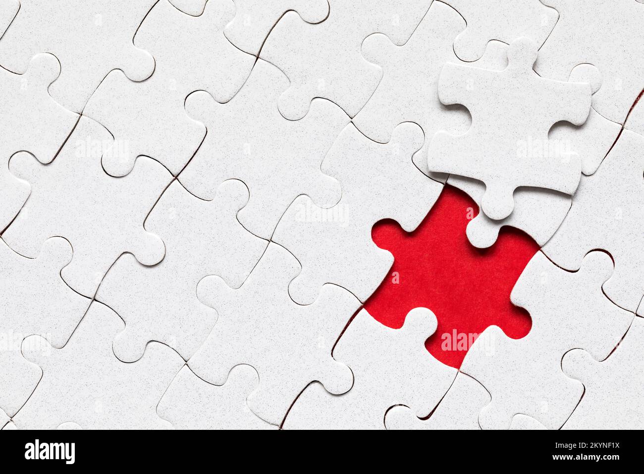White jigsaw puzzle pieces. Fill in pieces of the jigsaw puzzle ...