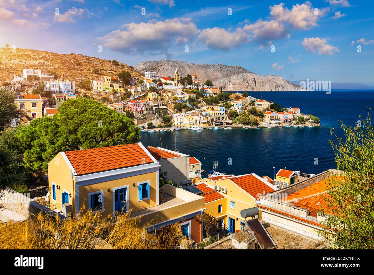 View of the beautiful greek island of Symi (Simi) with colourful houses ...