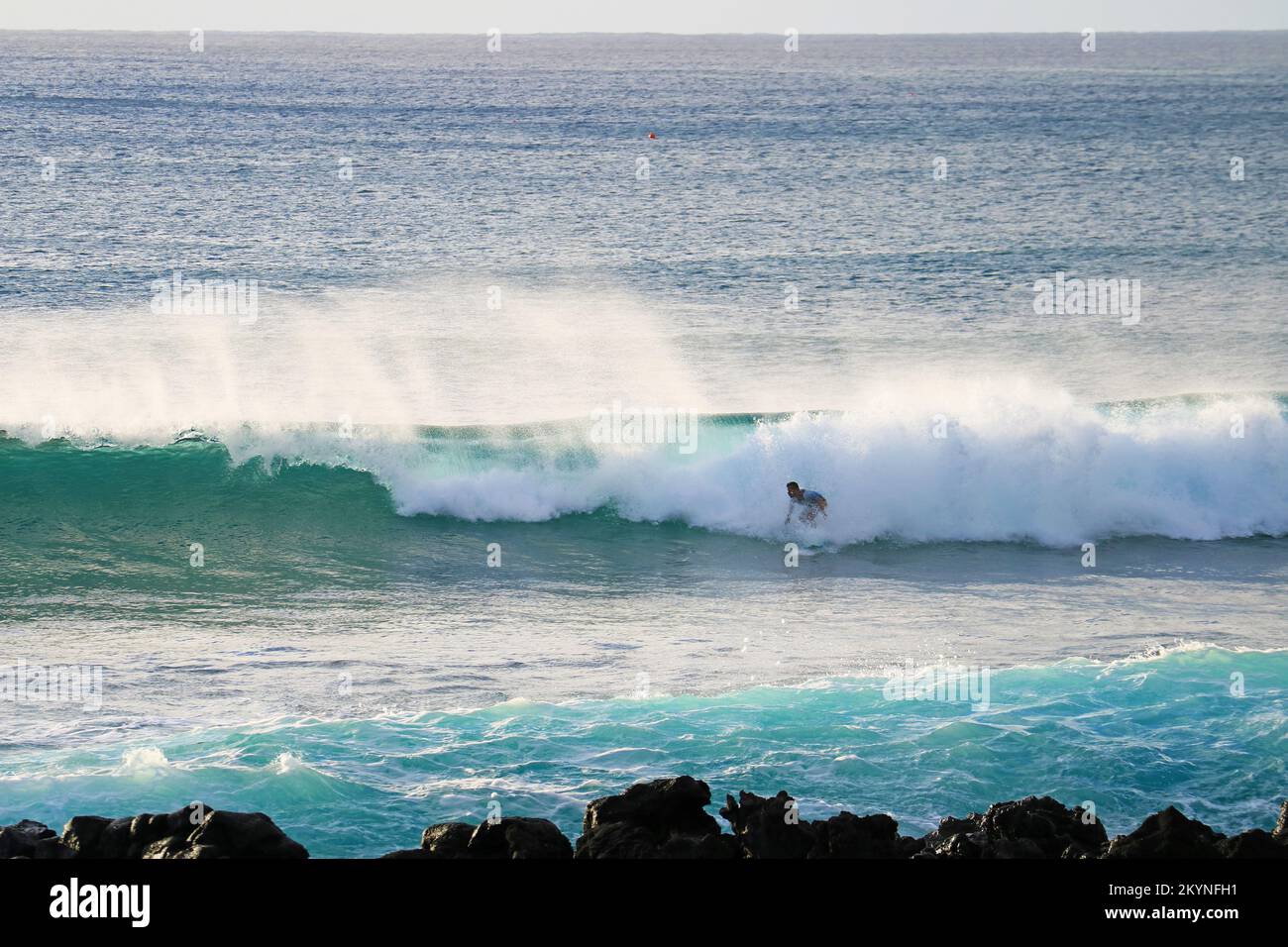 A Man Surfing on the Huge Waves in Pacific Ocean at Hanga Roa Town ...