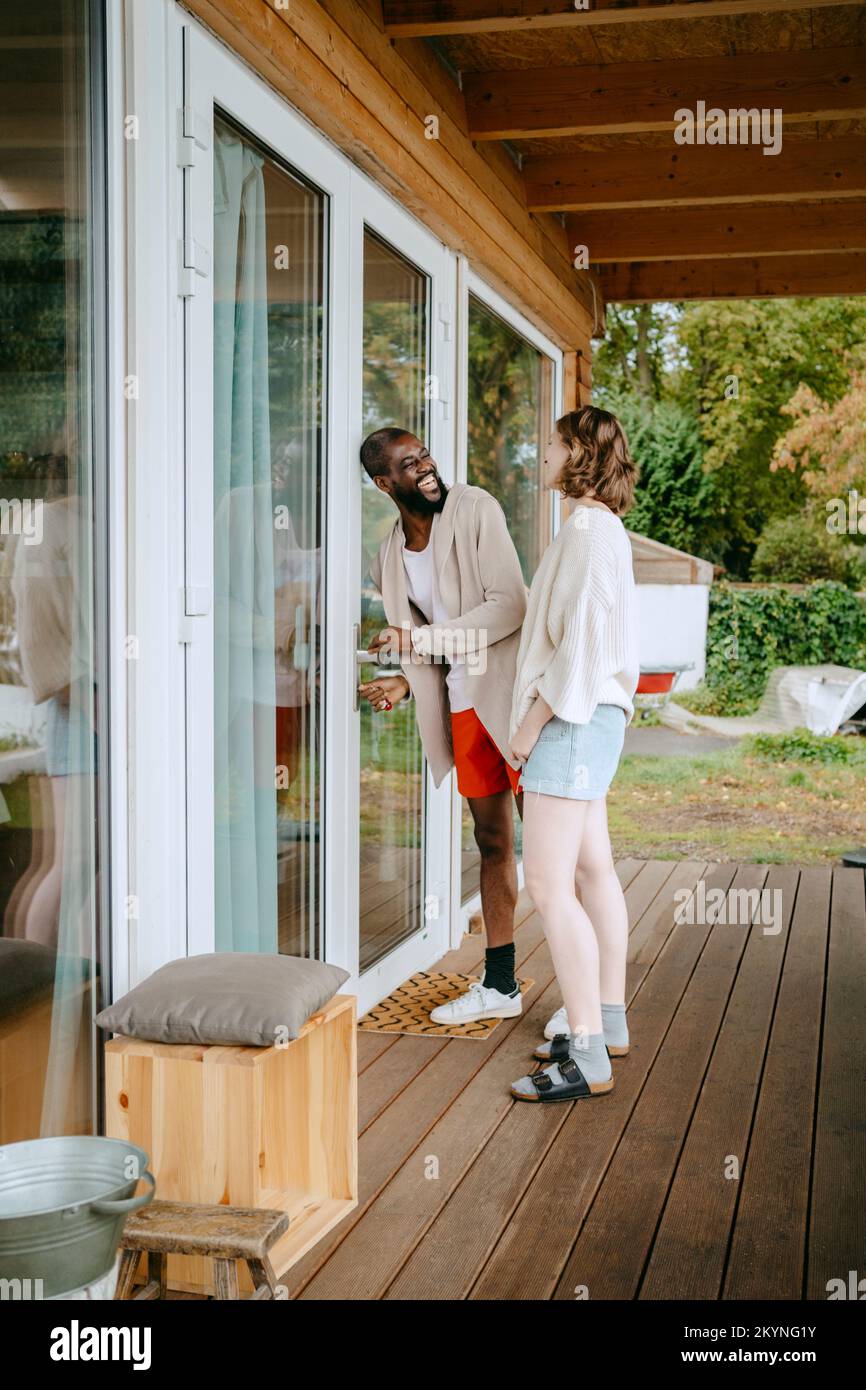 Couple entering house hi-res stock photography and images - Alamy