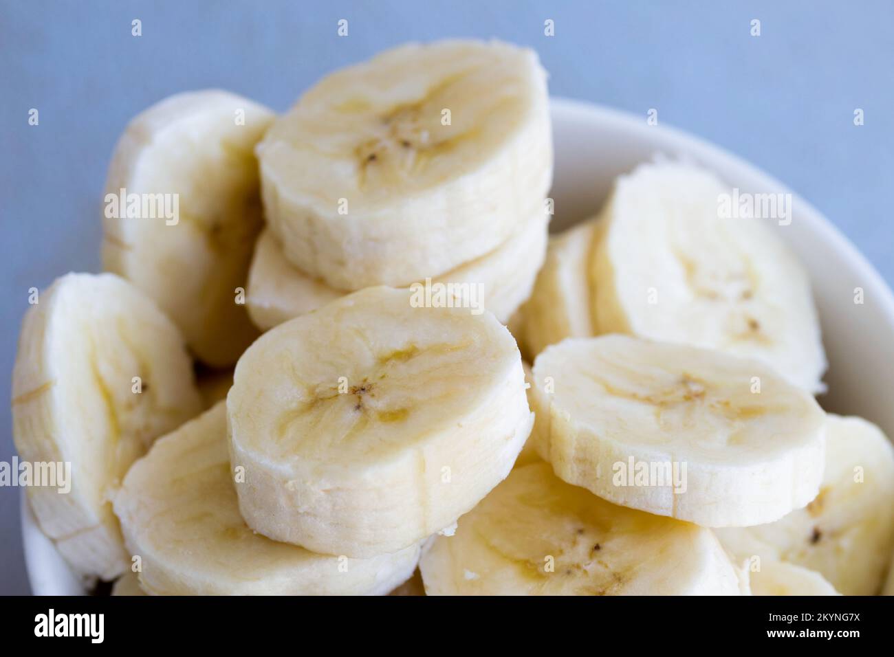 Sliced bananas in macro photography. Concept of healthy food and fruits ...