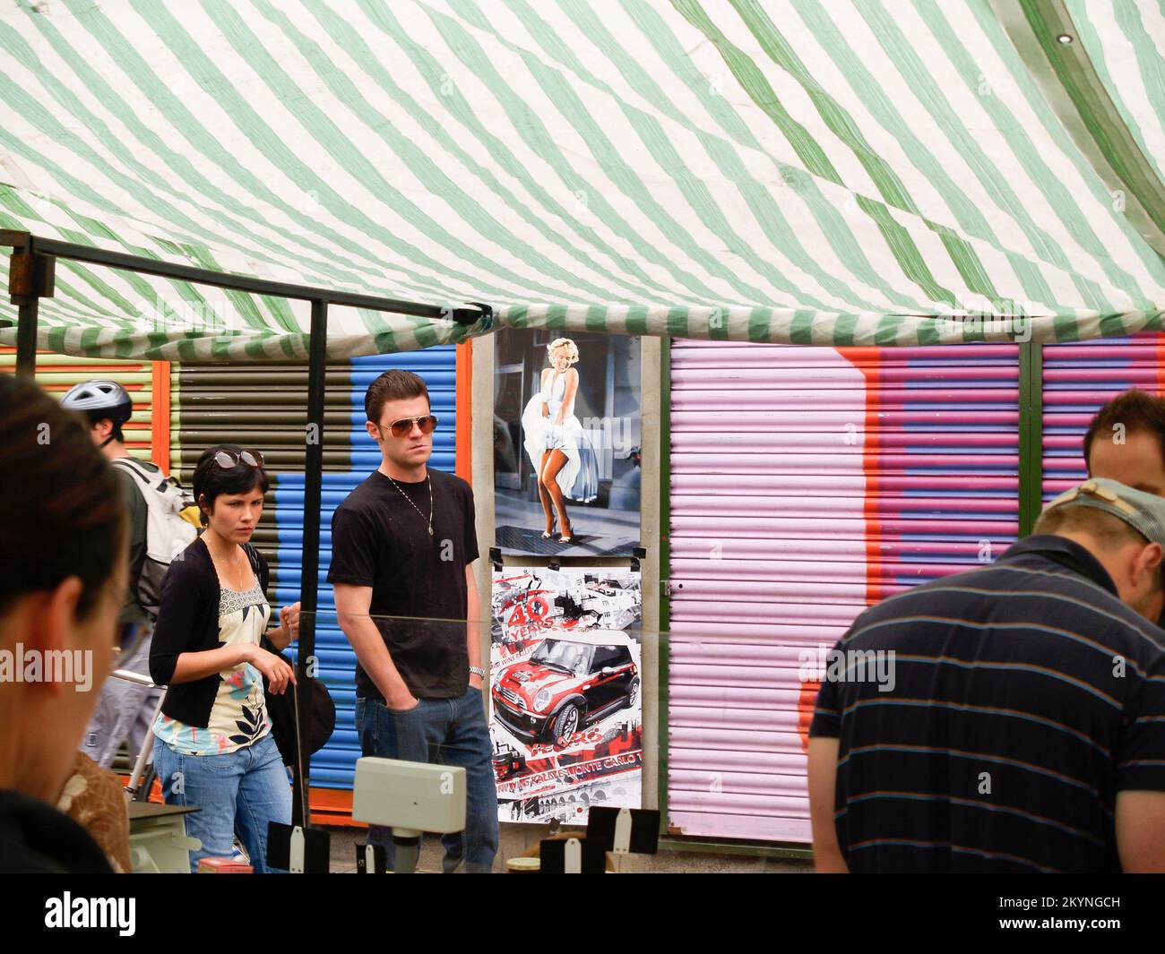 People under shade cover in London street market in 2009 Stock Photo ...