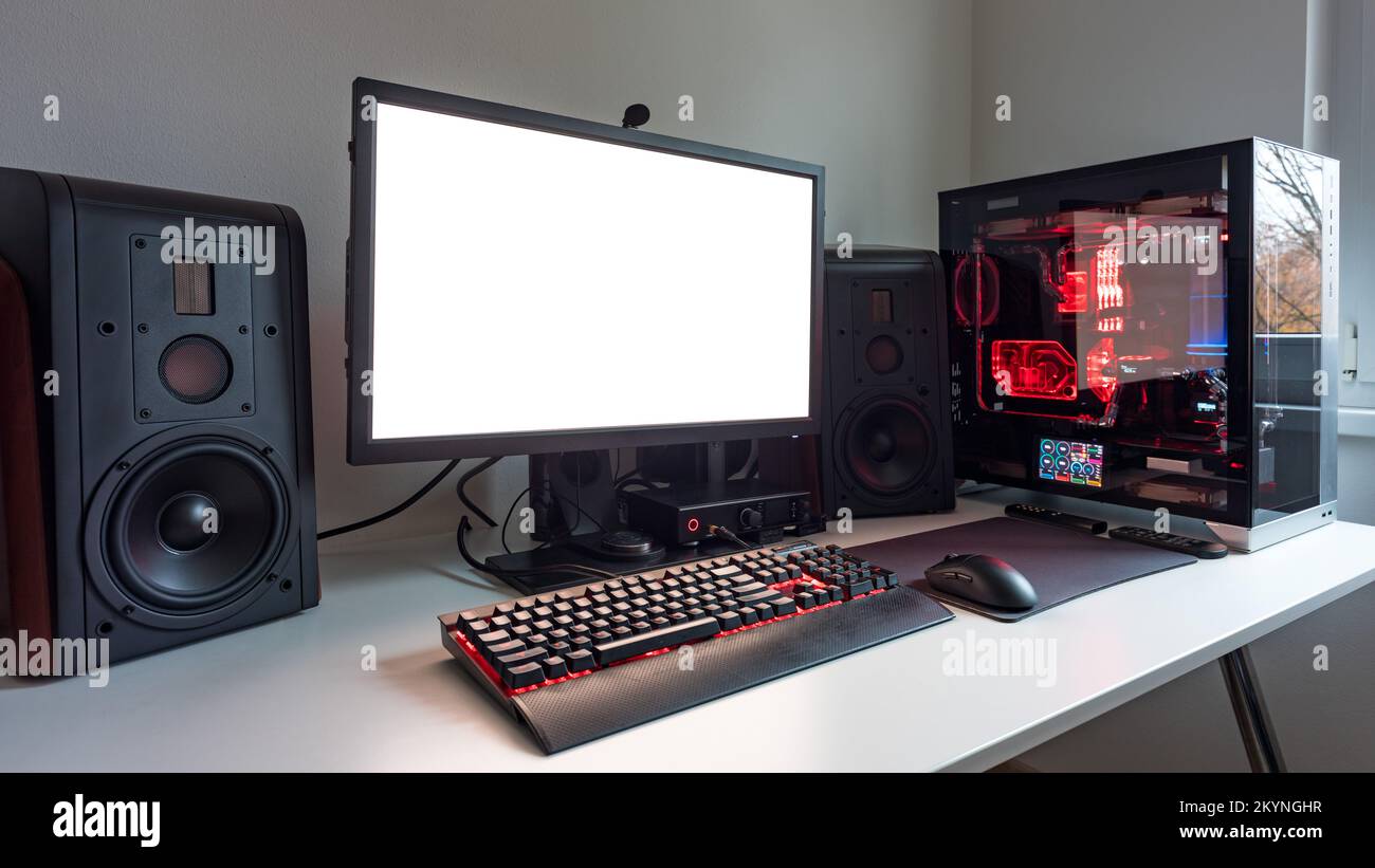 Powerful personal computer gamer rig with white screen. Professsional ...