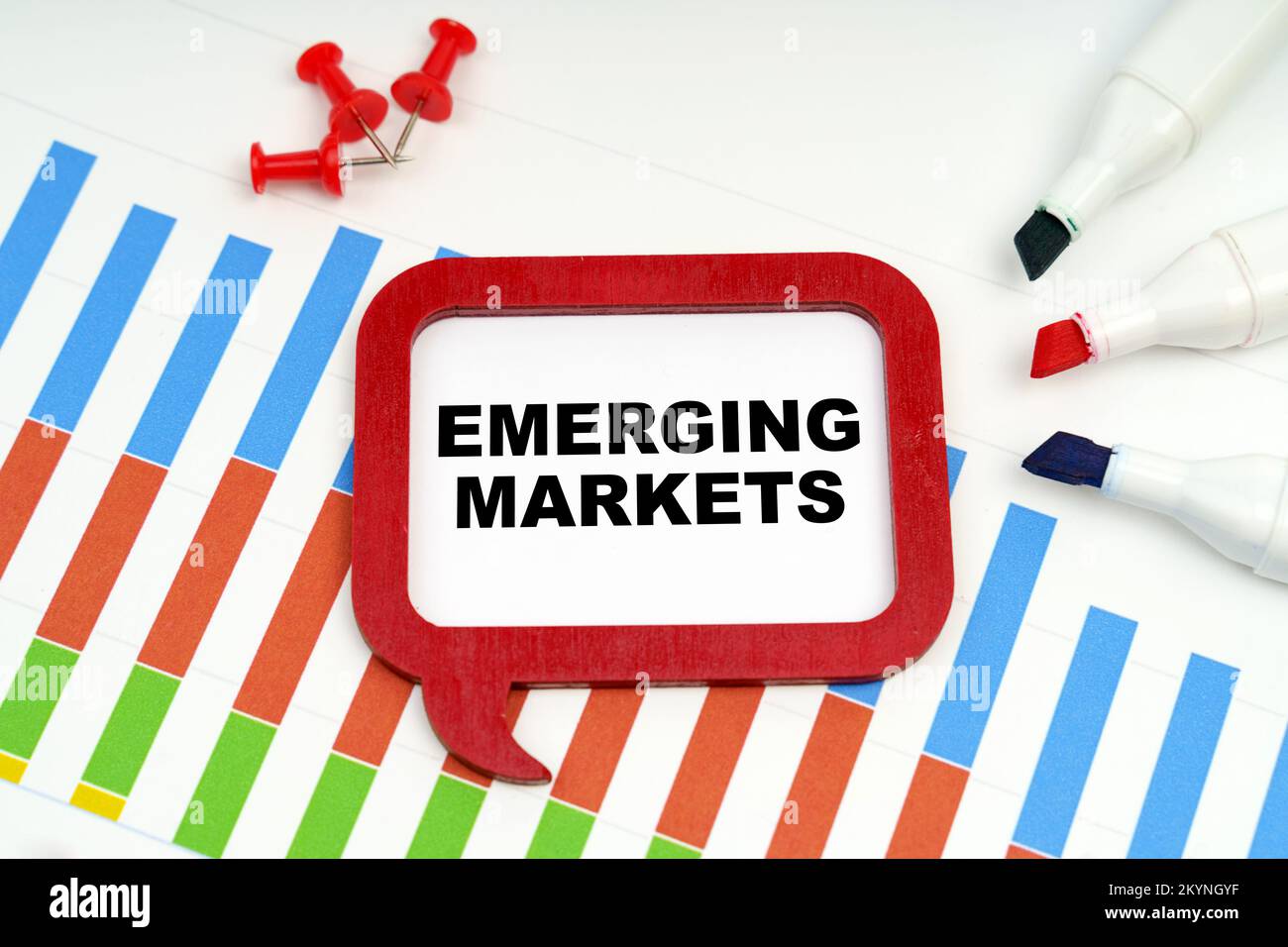 Business and economy concept. There are markers, charts and a sign on ...