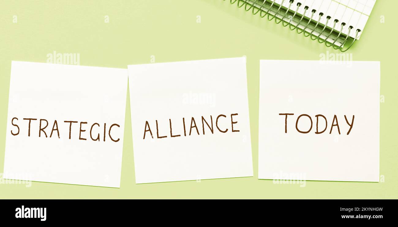 Hand writing sign Strategic Alliance. Internet Concept a bond between ...