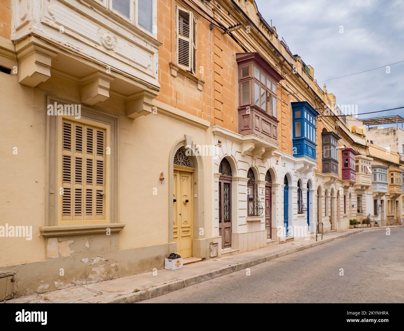 Sliema, Malta - May, 2021: Narrow street and historic sand-colored ...