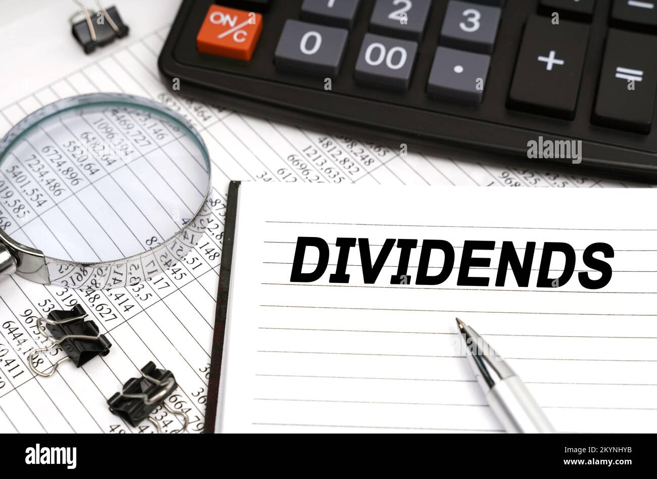 Business concept. On the table is a magnifying glass, a calculator, a ...