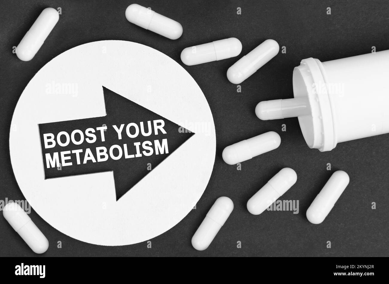 Medicine concept. Pills on a black background. They are indicated by a ...