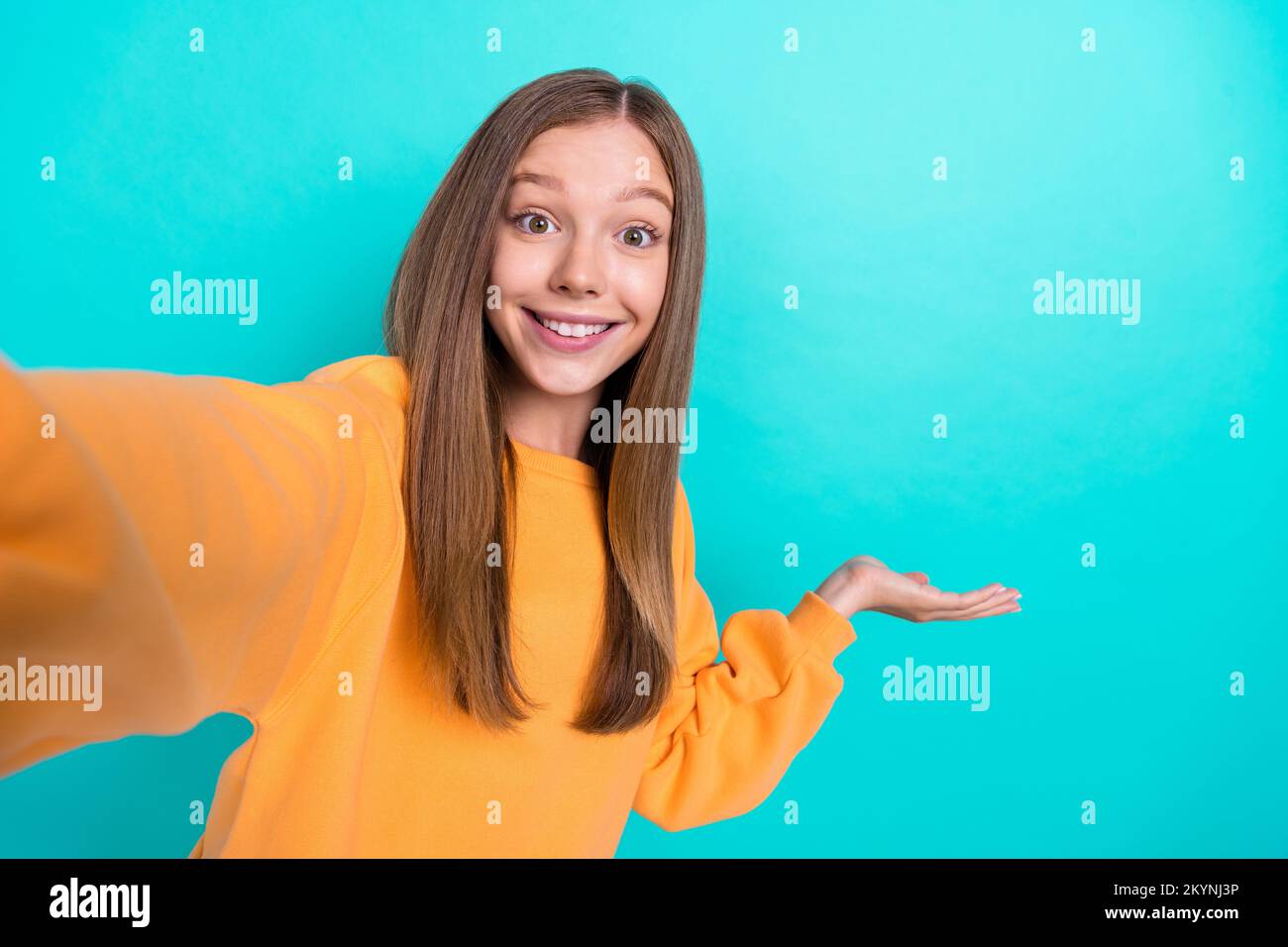 Selfie closeup photo cadre of young positive girl hold palm recommend empty space new product ...