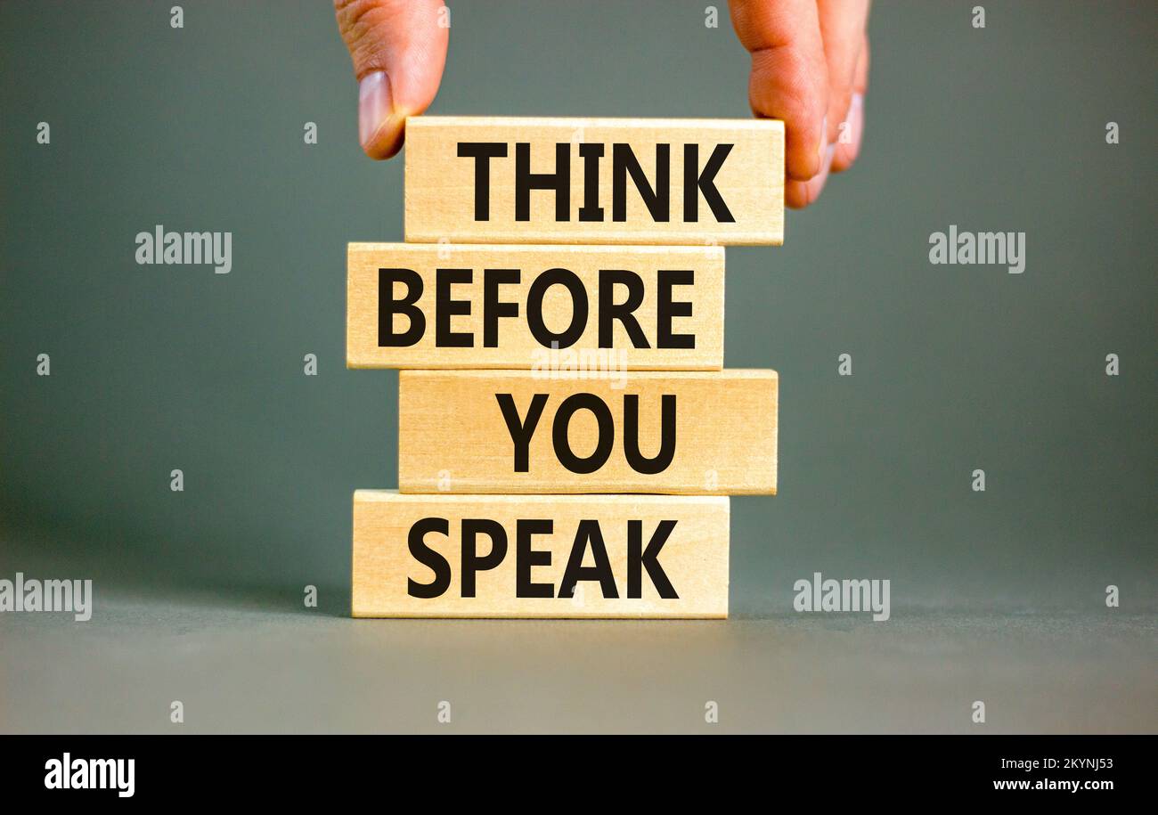 Think before you speak symbol. Concept words Think before you speak on wooden cubes. Beautiful ...