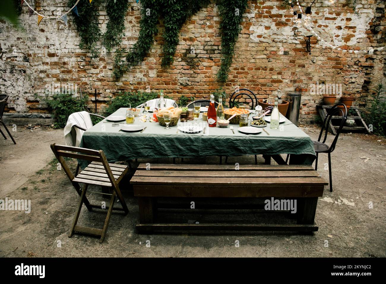 Empty back yard with food and drink set up on dining table Stock Photo ...